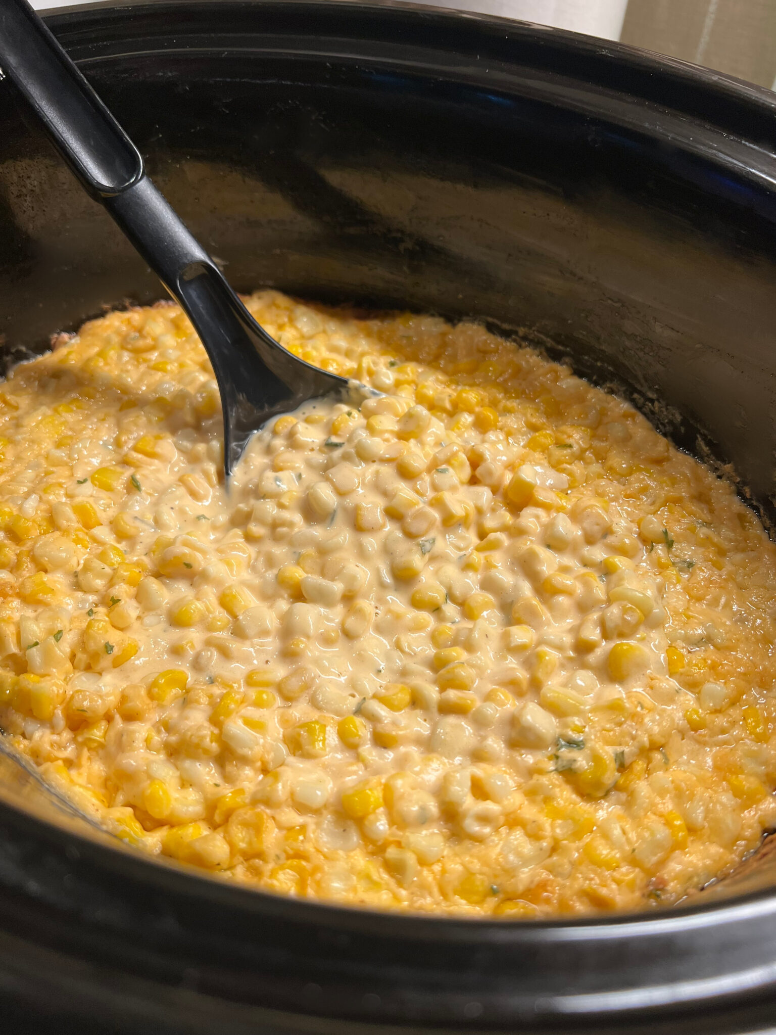 Slow Cooker Cheesy Cheddar Creamed Corn - Sweet Little Bluebird