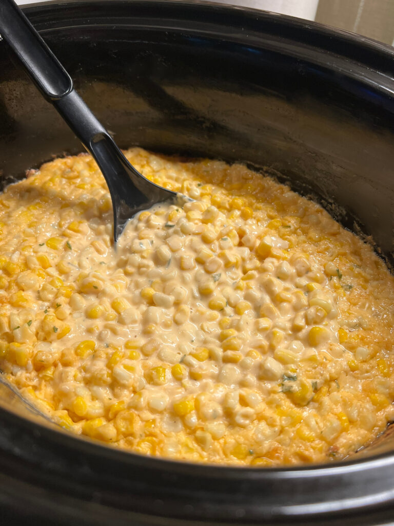 Slow Cooker Cheesy Cheddar Creamed Corn - Sweet Little Bluebird