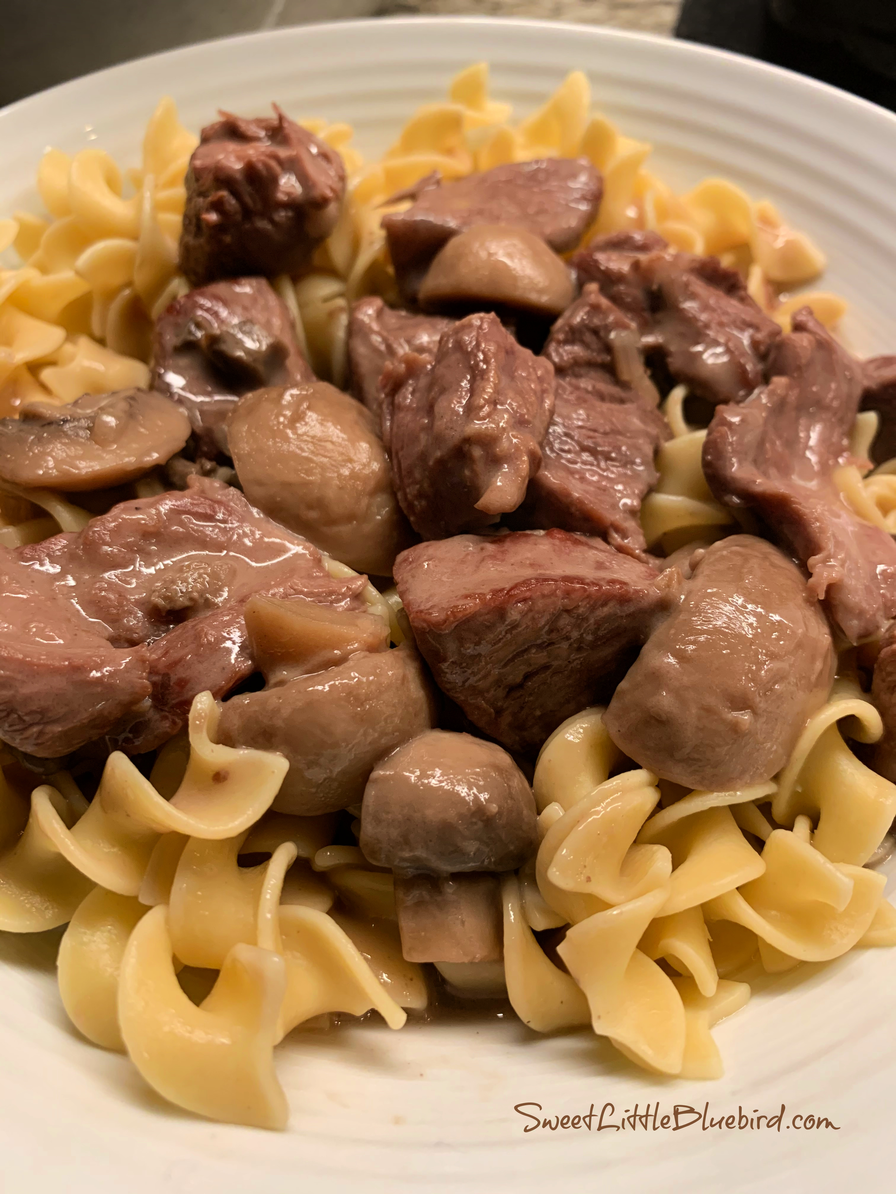 Slow Cooker Smothered Beef Tips (Easy) - Sweet Little Bluebird